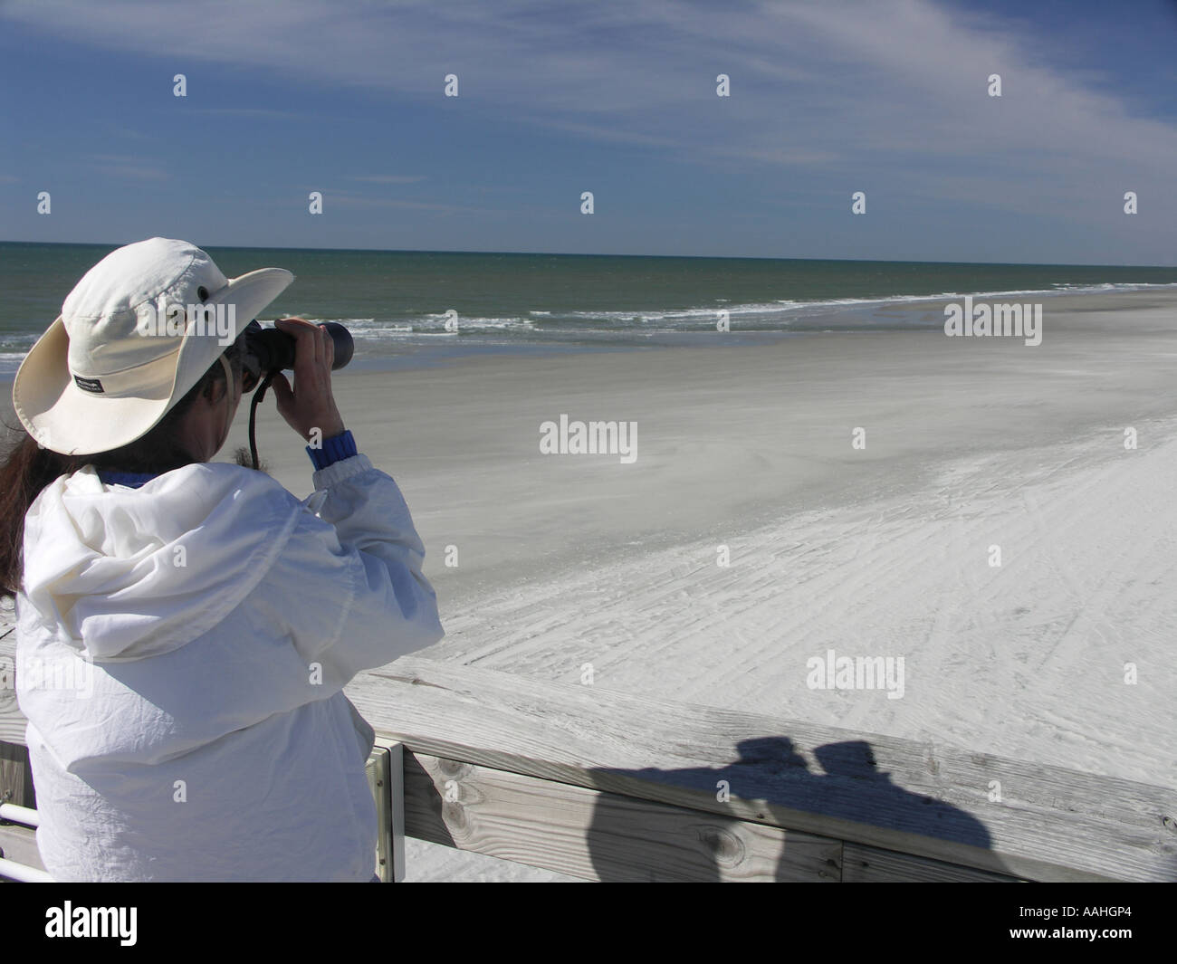 Look through binoculars look at beach hi-res stock photography and ...
