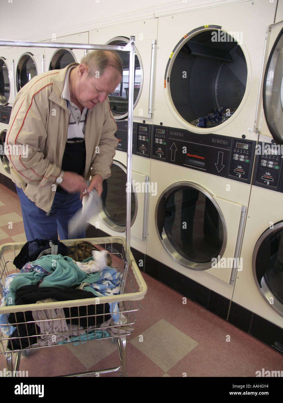 Man inside dryer laundromat clothing hi-res stock photography and ...