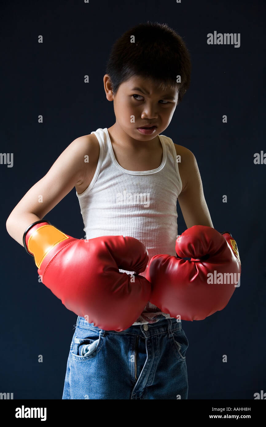 Kid with a mean look Stock Photo - Alamy