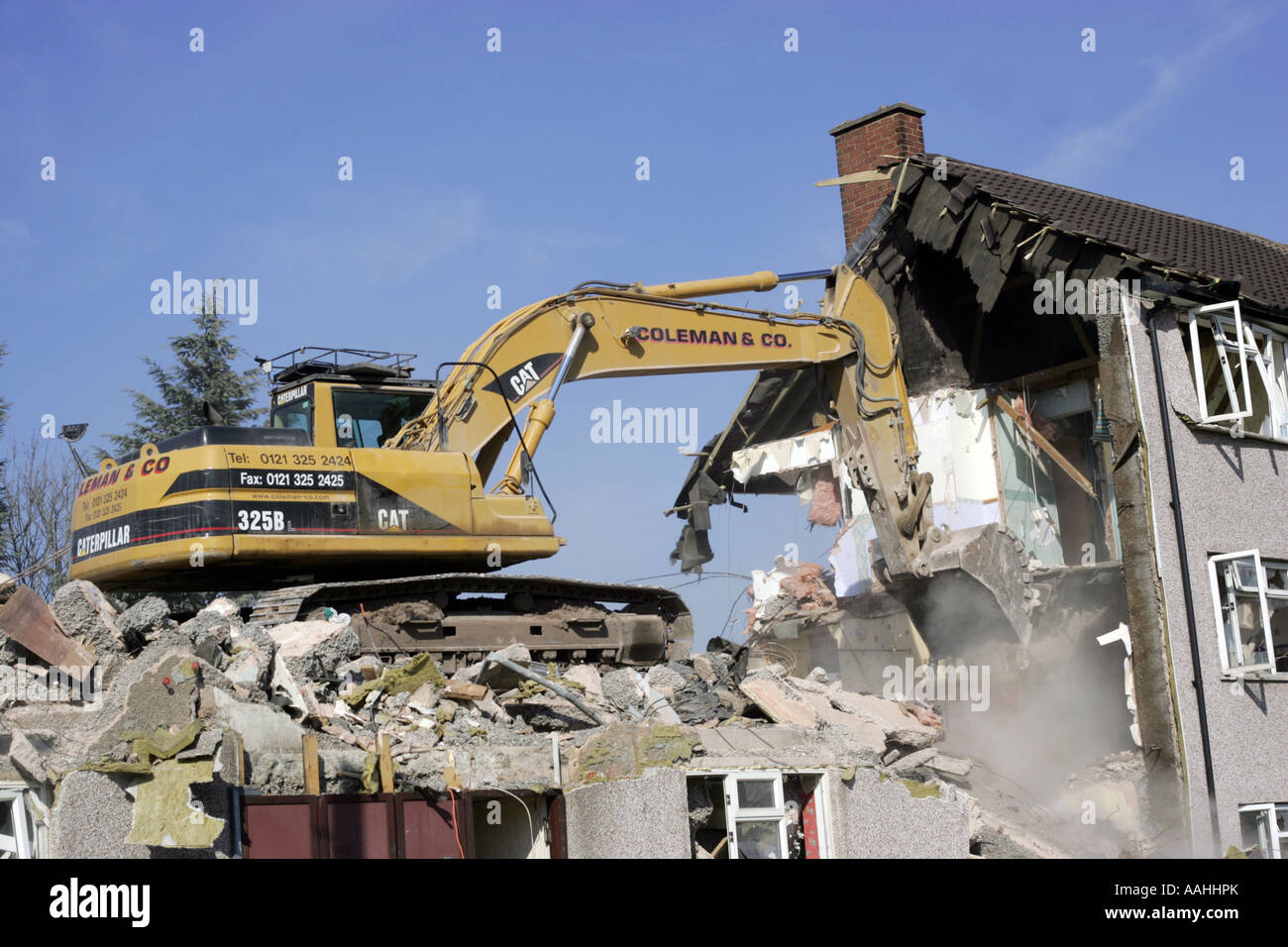 A bulldozer demolishing old council houses in Ley Hill, Northfield ...
