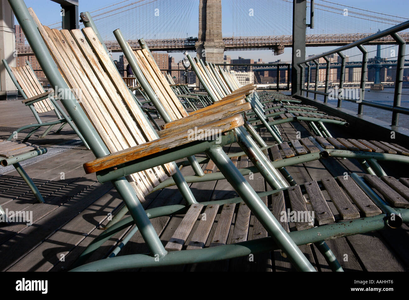 Empty deck chairs outside a scenic New York City waterfront Pier 17 ...