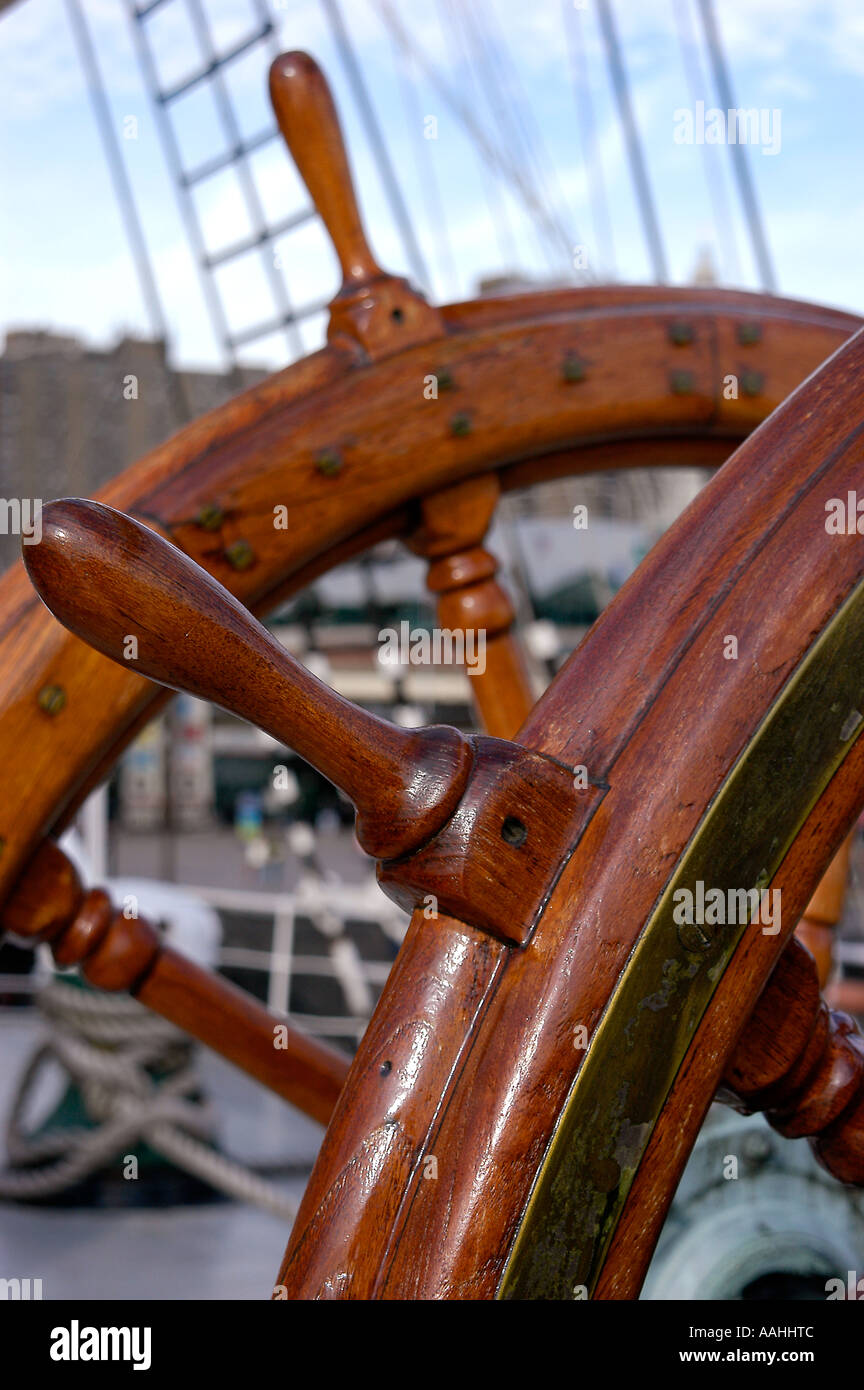 A detail of a wooden ships captains steering wheel as part of an old ...