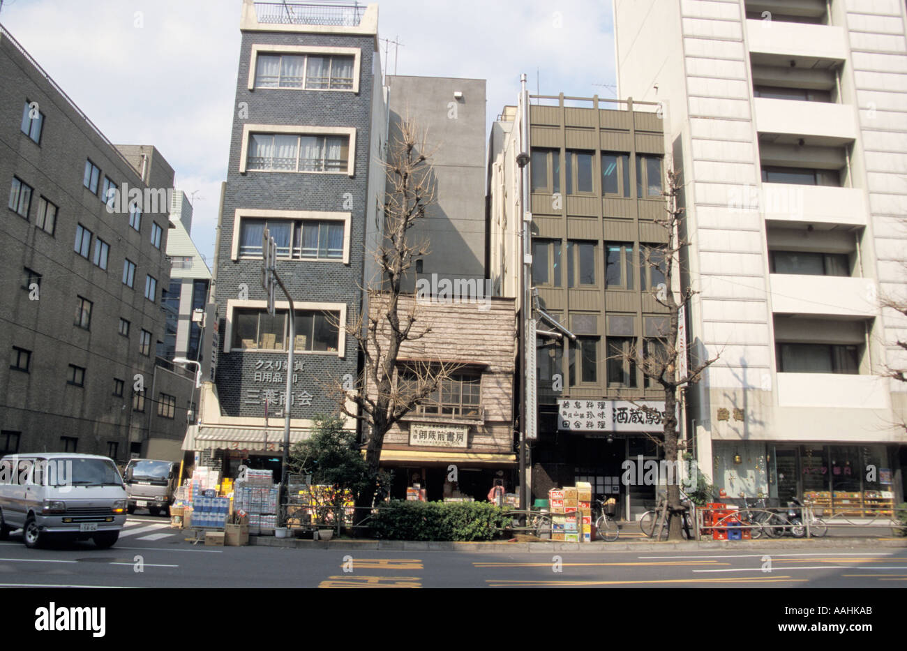 Japan Tokyo Old shop wedged between two modern buildings Stock Photo ...