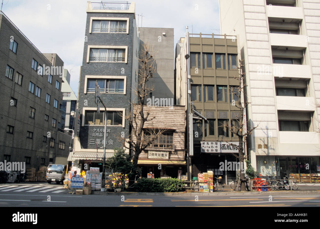 Japan Tokyo Old shop wedged between two modern buildings Stock Photo ...
