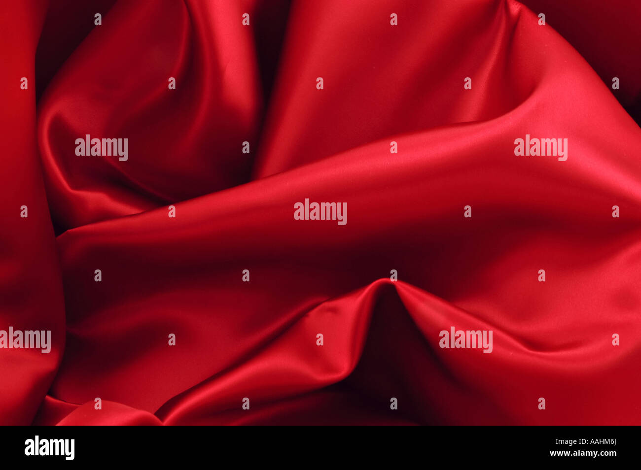Piece of red satin fabric for a background texture Stock Photo - Alamy