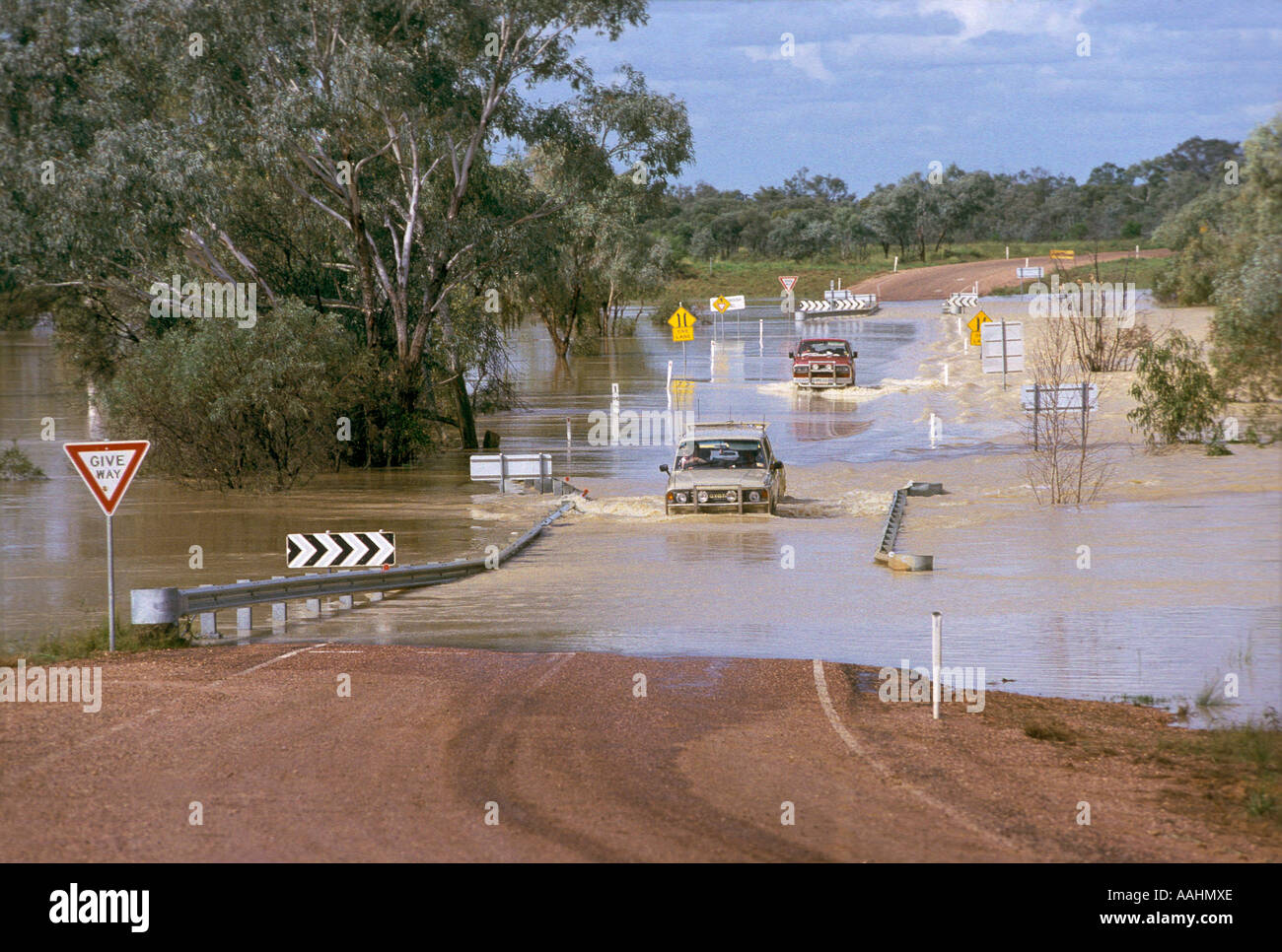 Flooded highway Thomson River Muttaburra Channel Country Queensland ...