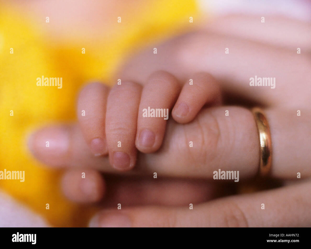 Baby hand holding finger ring hi-res stock photography and images - Alamy