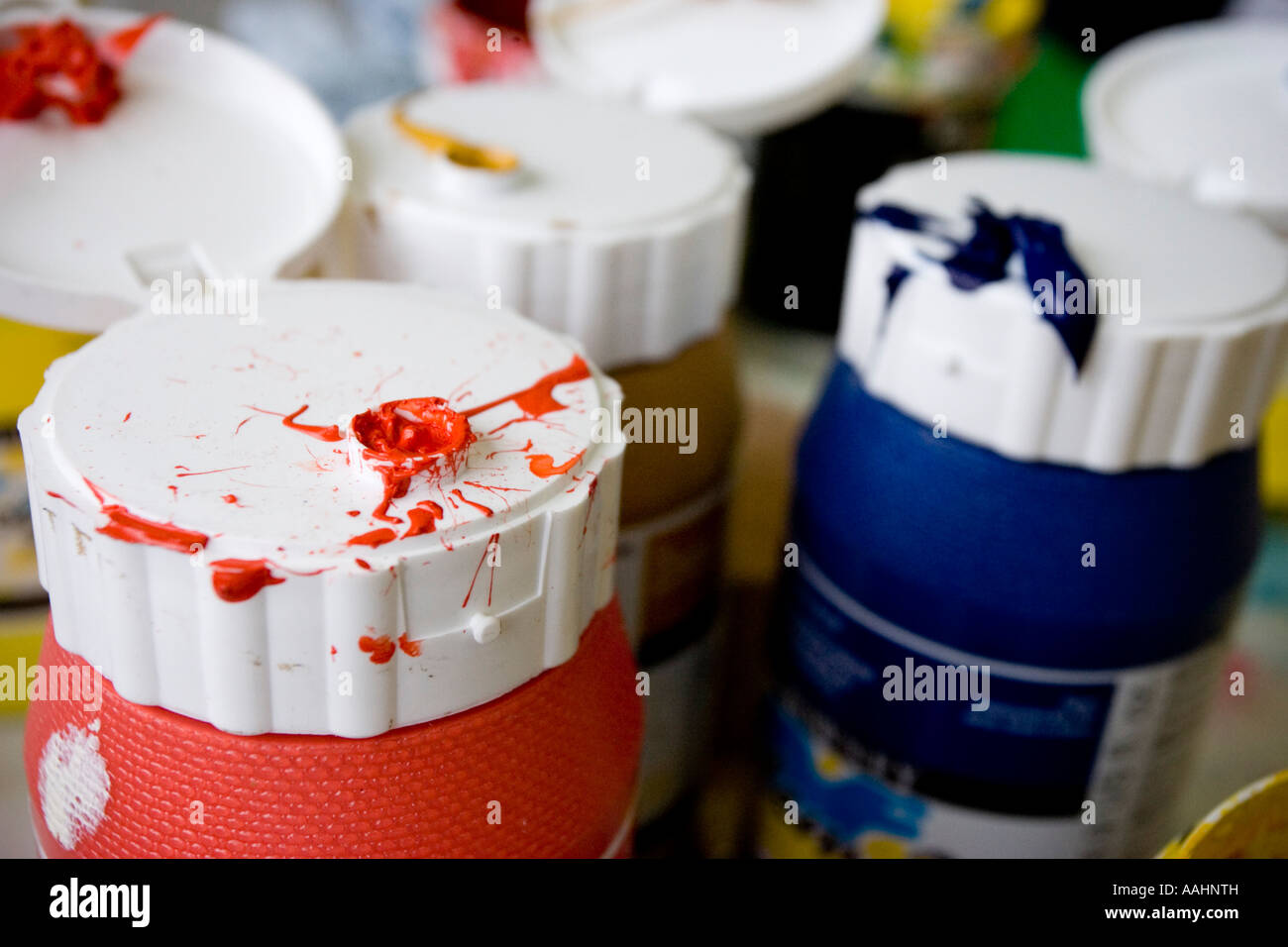 Close up of the lids of child's poster paint pots Stock Photo - Alamy