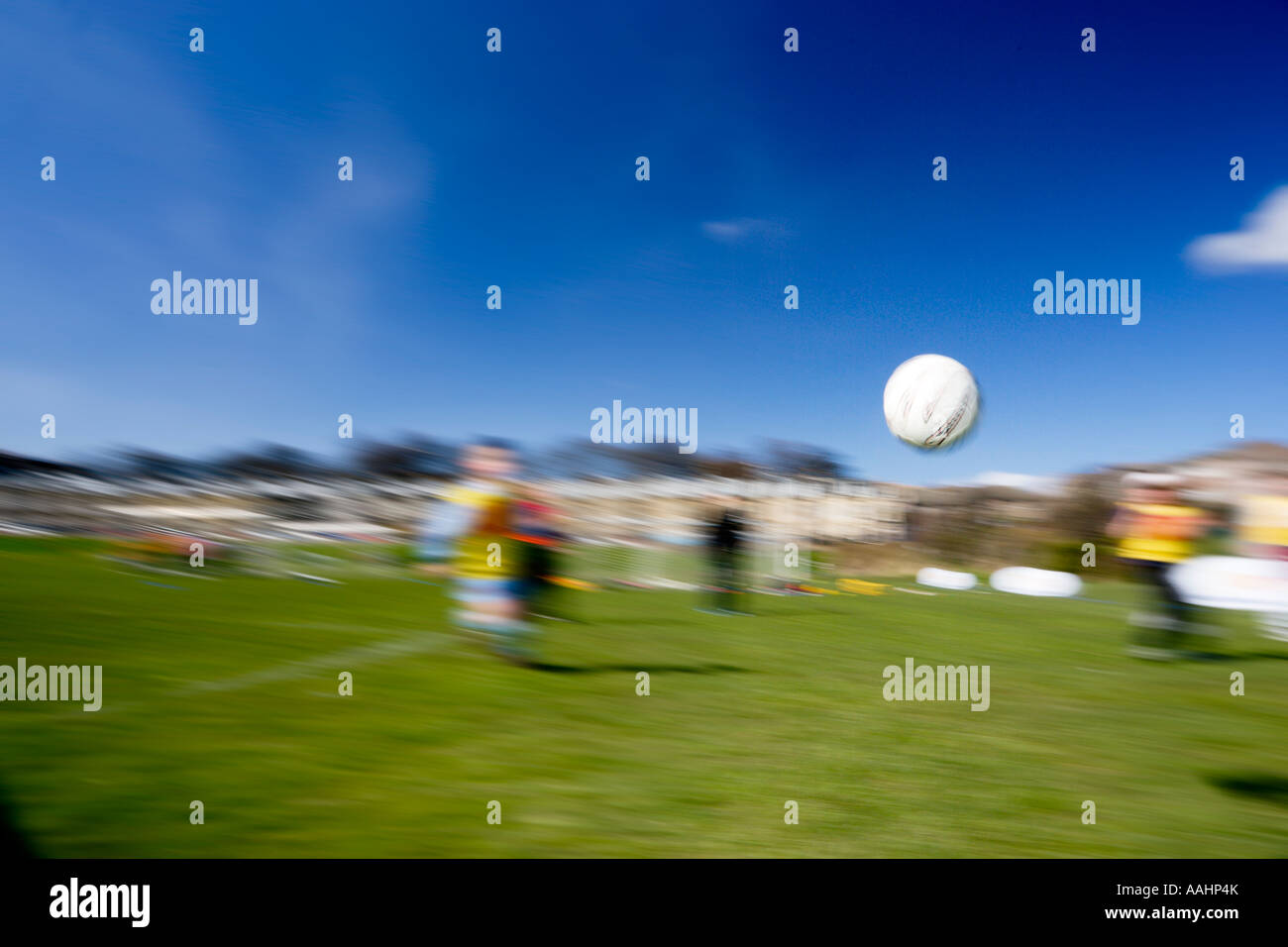 Blurry motion shot of football flying through the air Stock Photo - Alamy