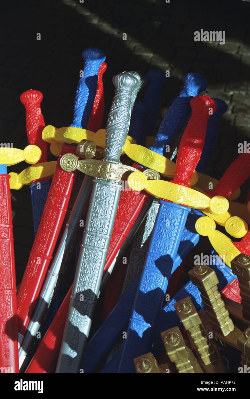 many colourful plastic toy swords Stock Photo - Alamy