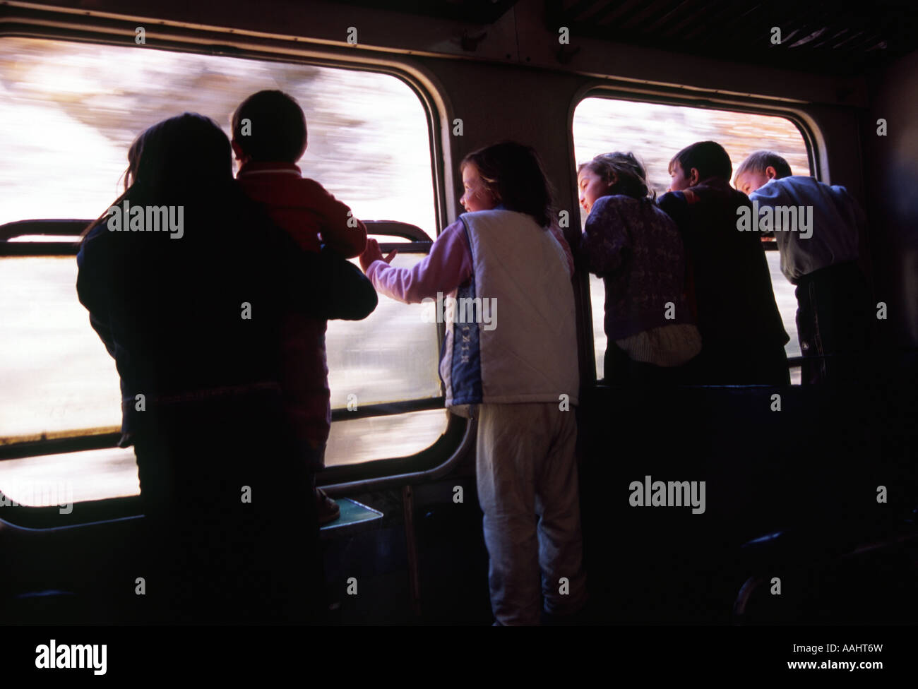 Gyspy children peer out the windows of a narrow gauge coach, Septemvri ...