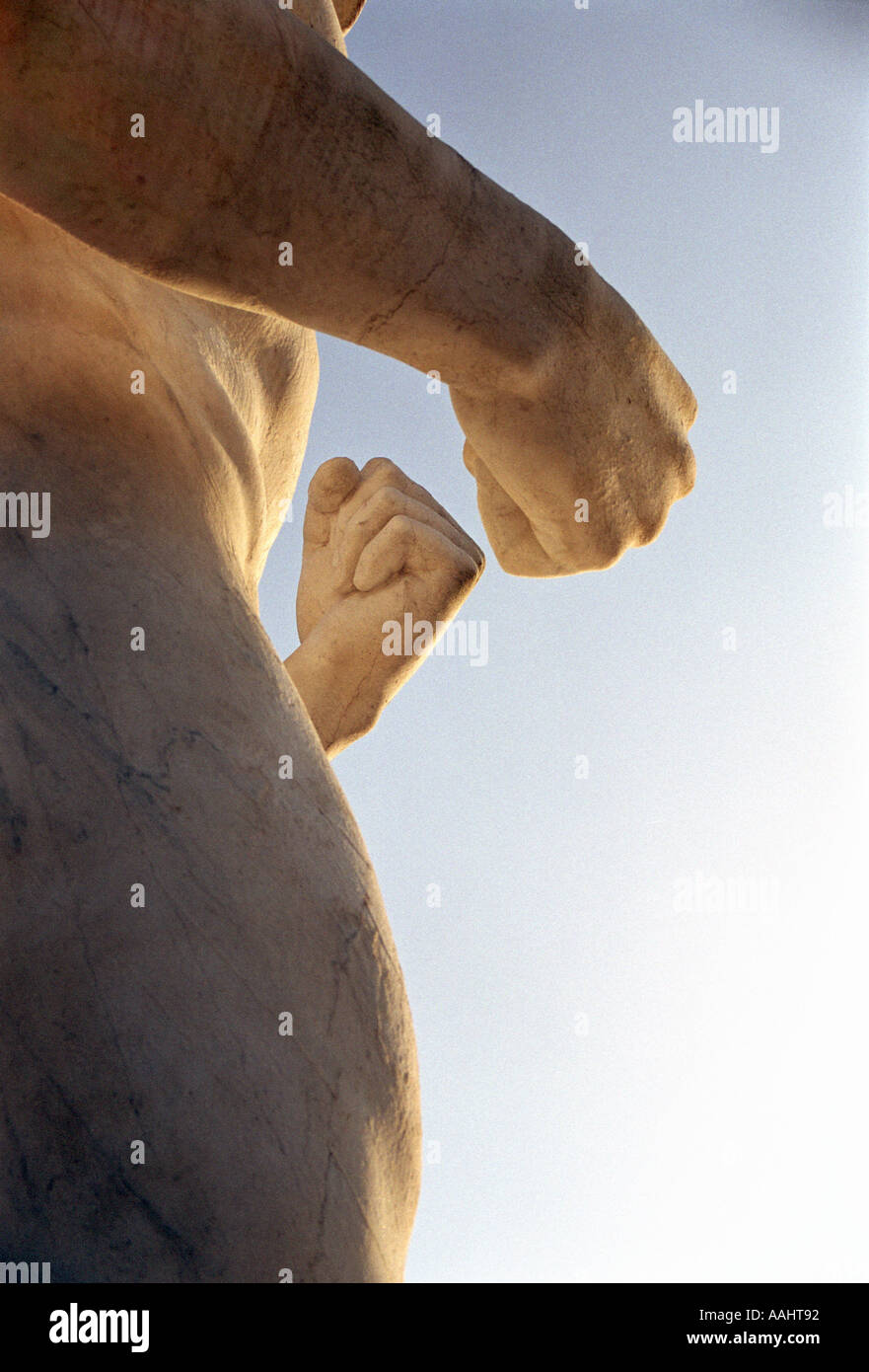 male statue s tense fists at stadio dei marmi rome Stock Photo - Alamy
