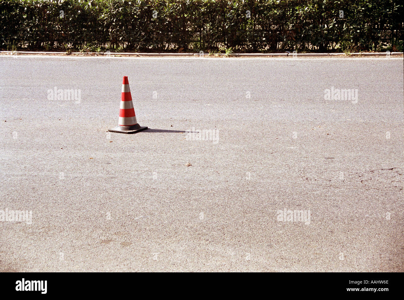 one traffic cone in middle of road Stock Photo - Alamy