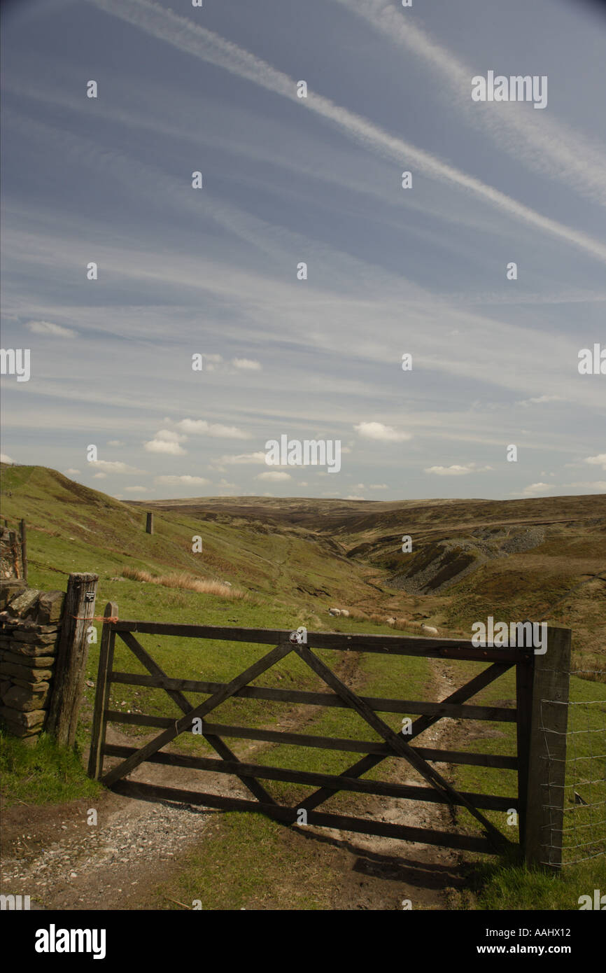 Looking over gate into the Peak district UK Stock Photo - Alamy