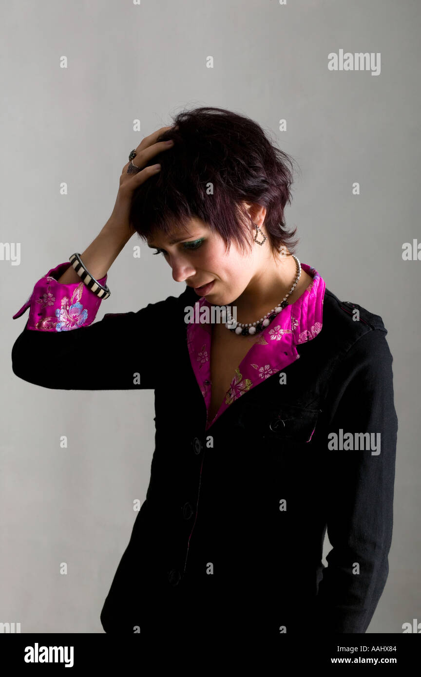 vertical sad young woman expressing anxiety Stock Photo - Alamy