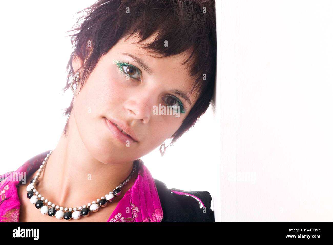 horizontal sad young woman expressing anxiety leaning against wall ...