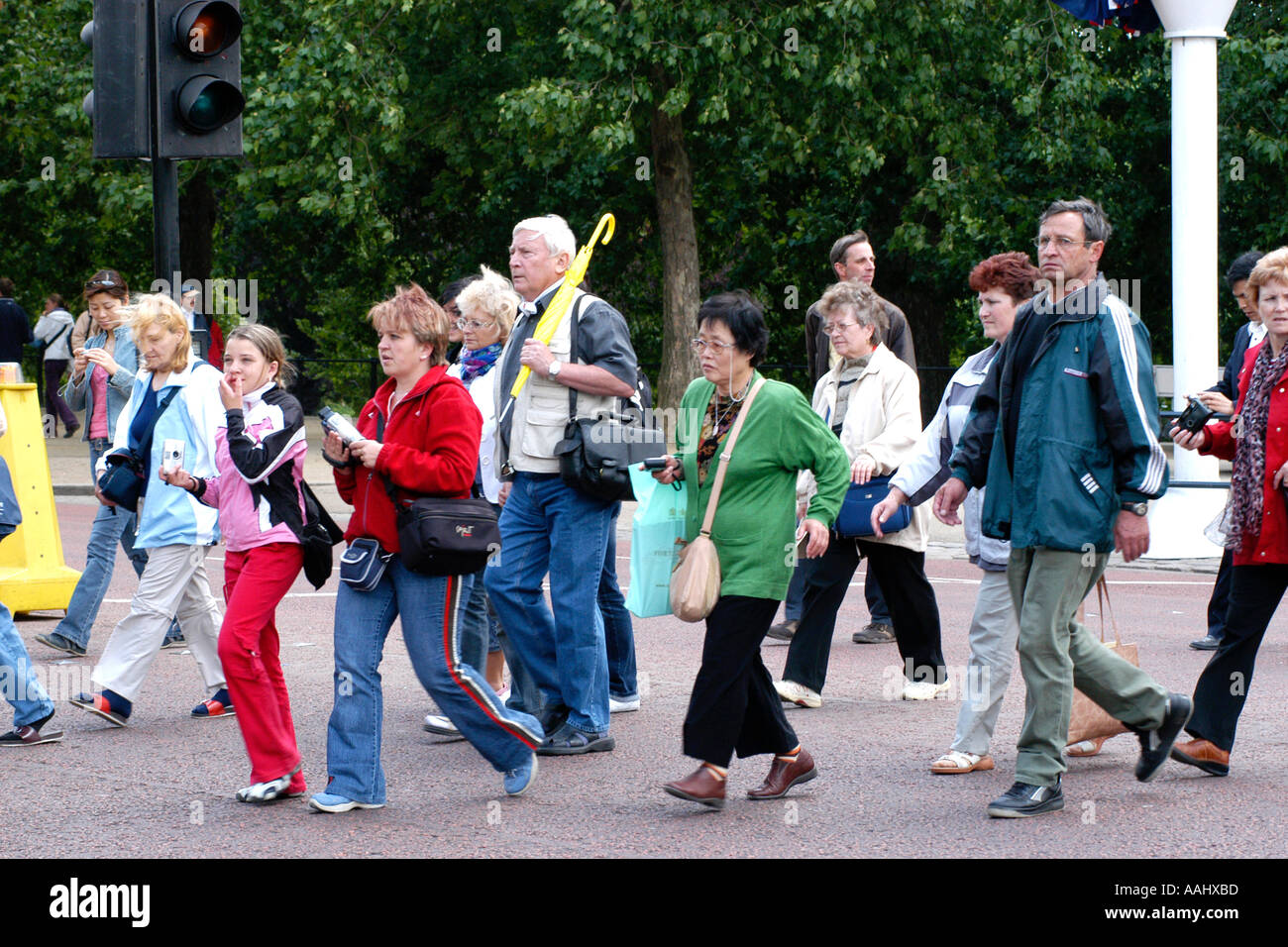 A group of Foreign Tourists walking around in London Stock Photo - Alamy