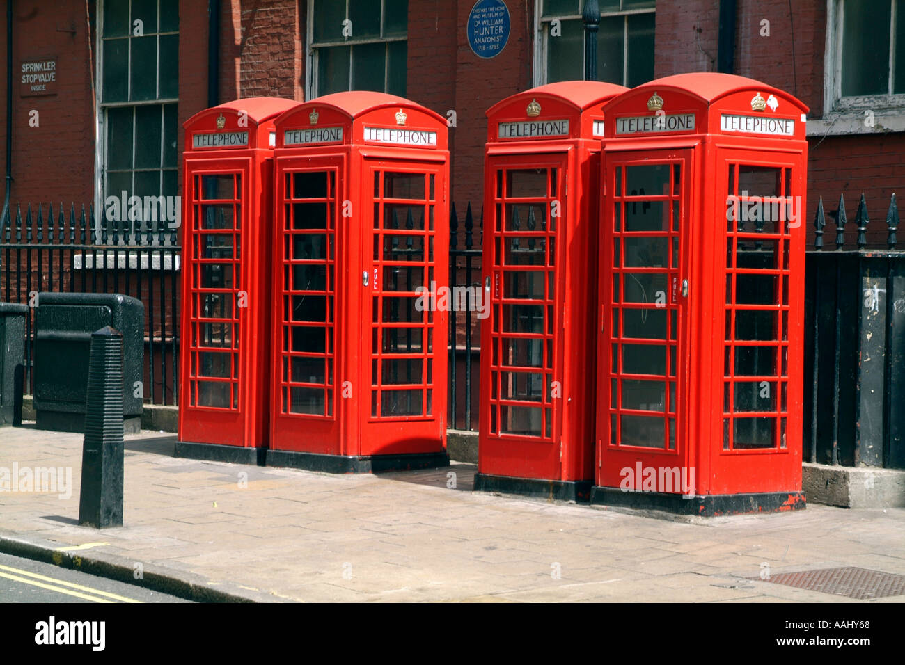 A row of red telephone boxes in London Stock Photo - Alamy