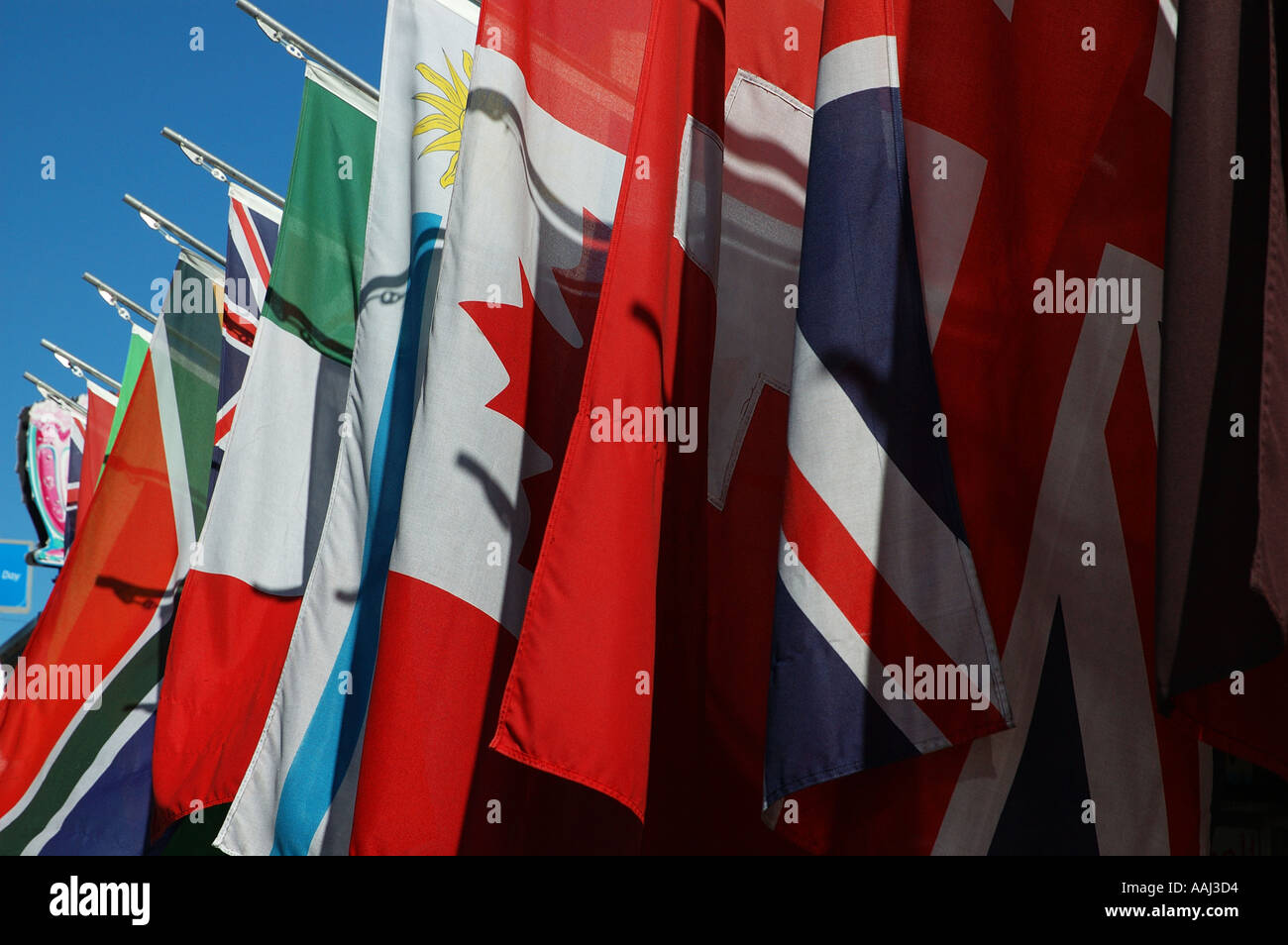Mixed national flags hanging in main street Atherton Queensland ...