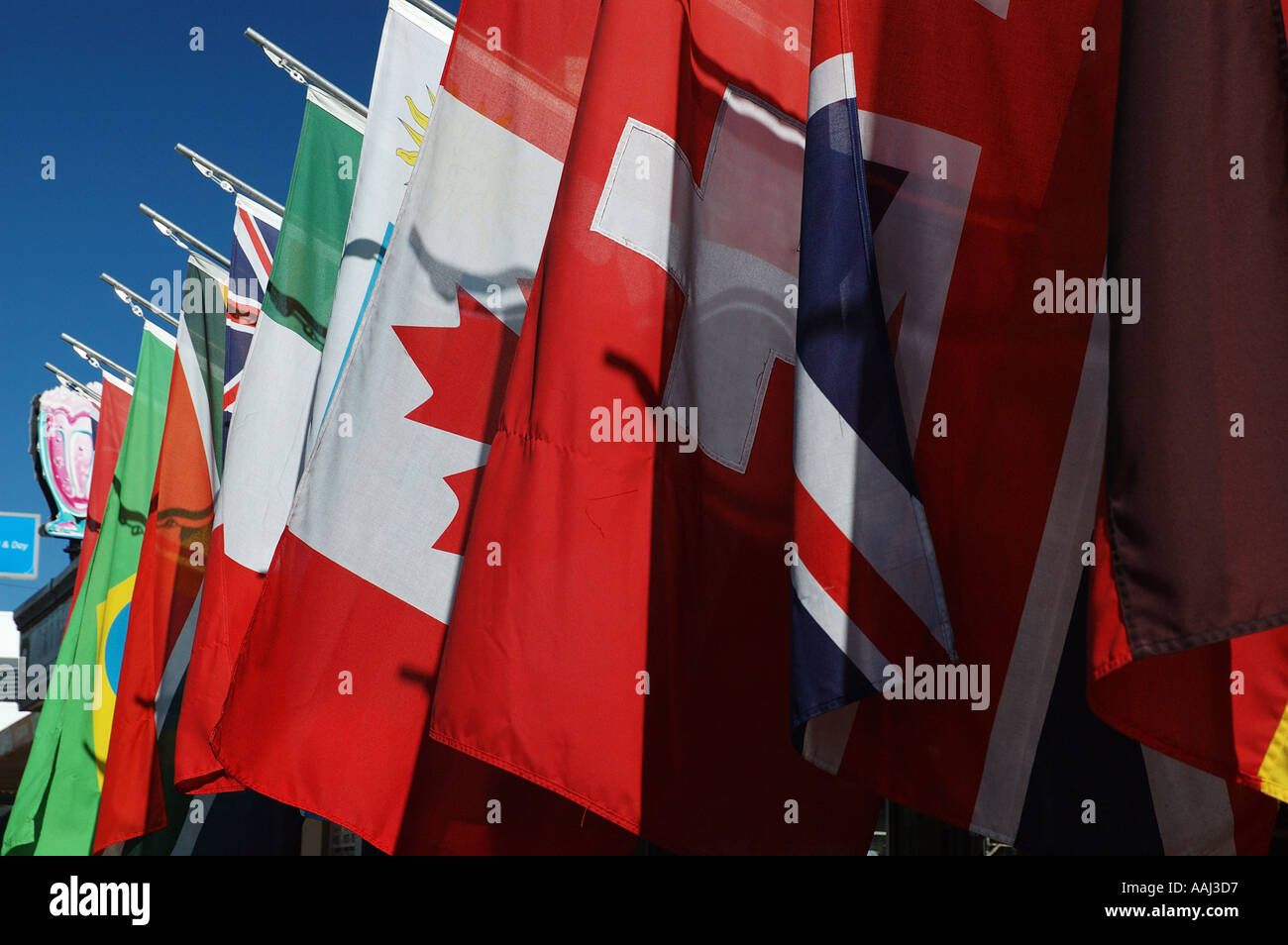 Mixed national flags hanging in main street Atherton Queensland ...