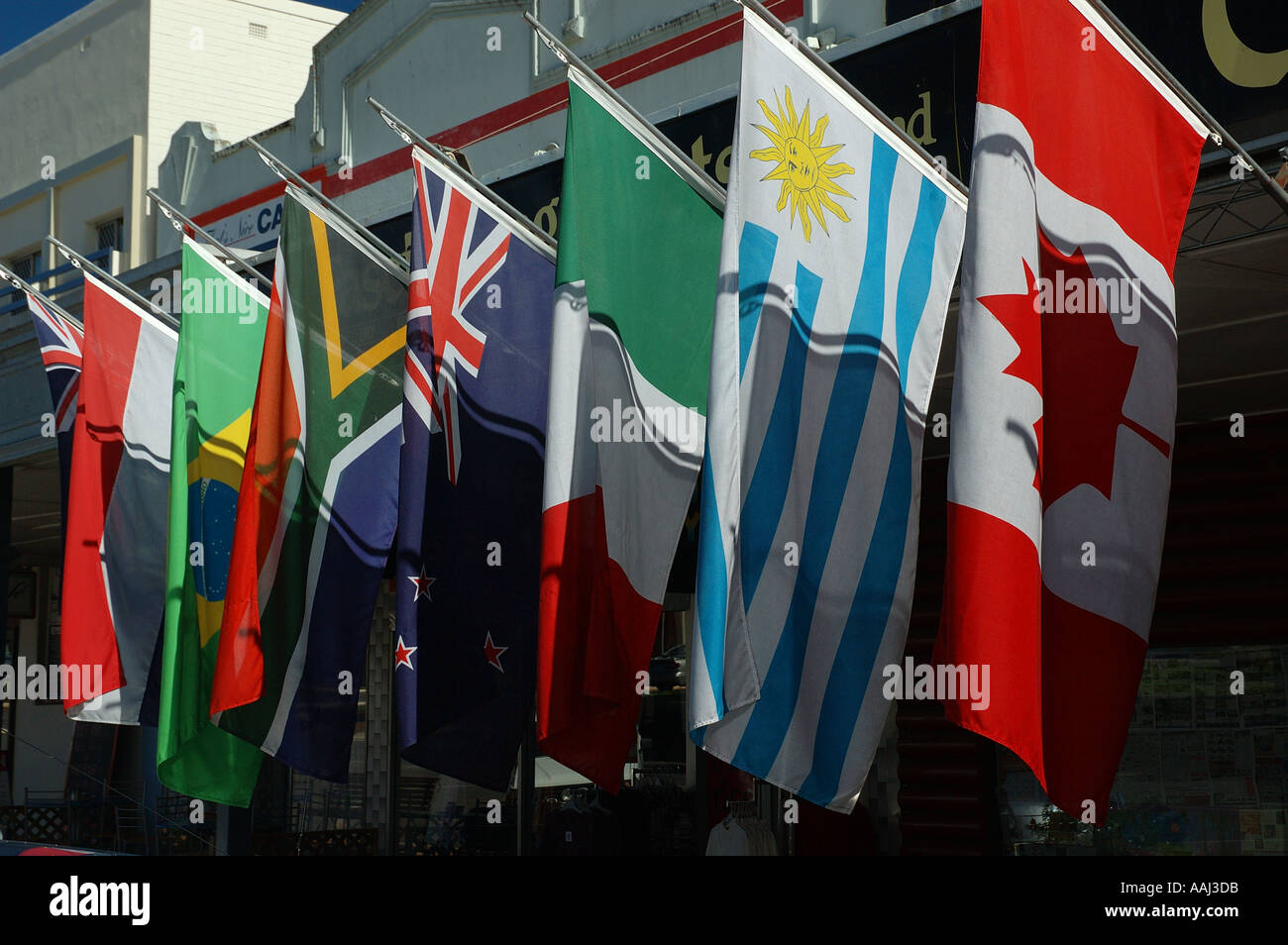 Mixed national flags hanging in main street Atherton Queensland ...