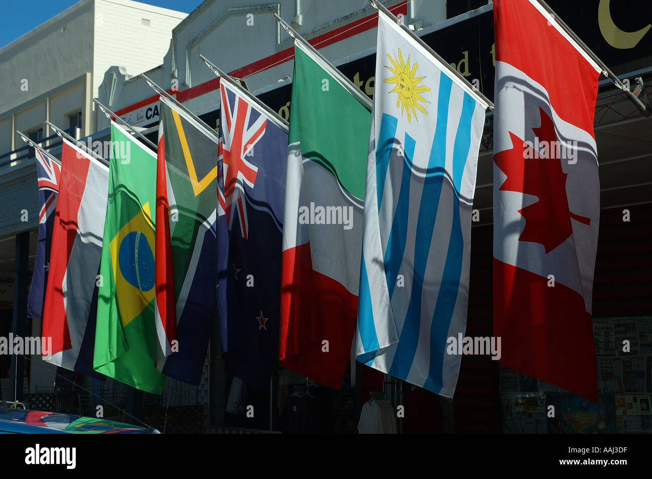 Mixed national flags hanging in main street Atherton Queensland ...