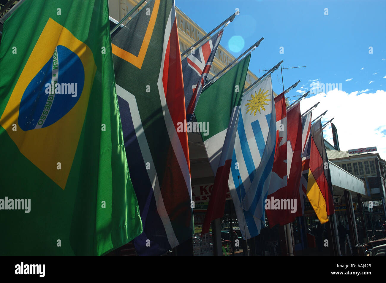 Mixed national flags hanging in main street Atherton Queensland ...