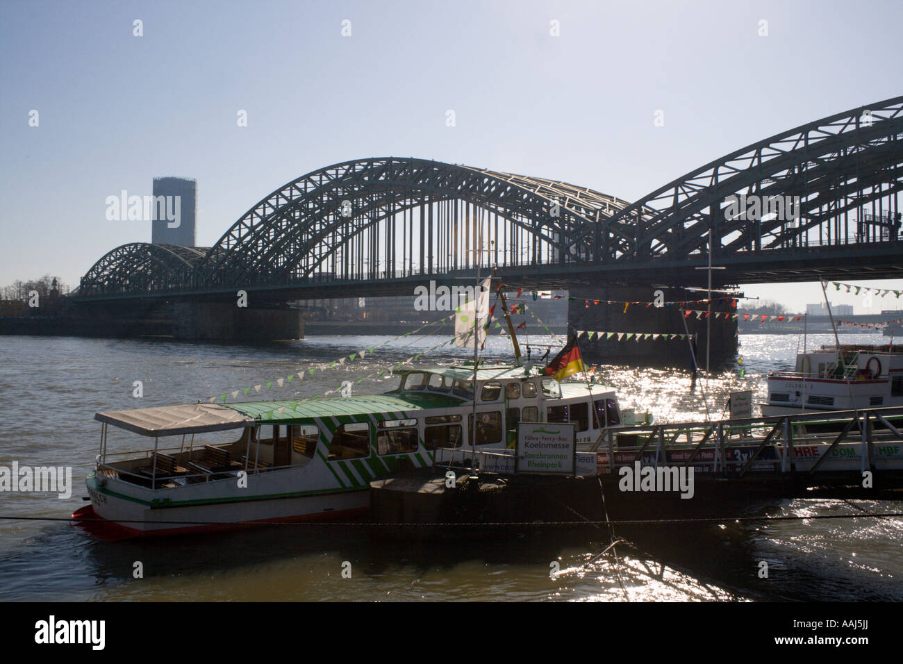 Rail bridge and river ferry boats on the Rhine Cologne Germany Stock ...