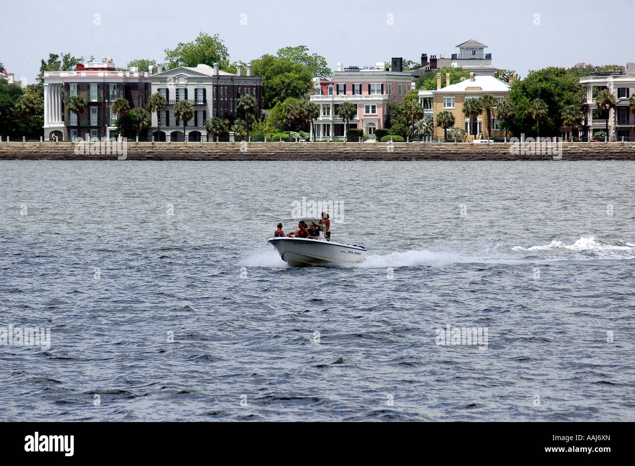 boat traveling along Charleston Harbor waterfront in front of The ...