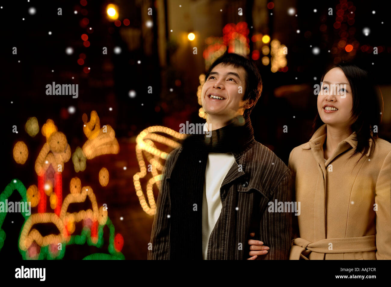 Couple looking up Stock Photo - Alamy
