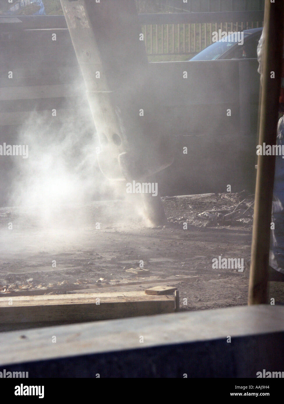 Breaking road surface with percussive hammer Stock Photo - Alamy