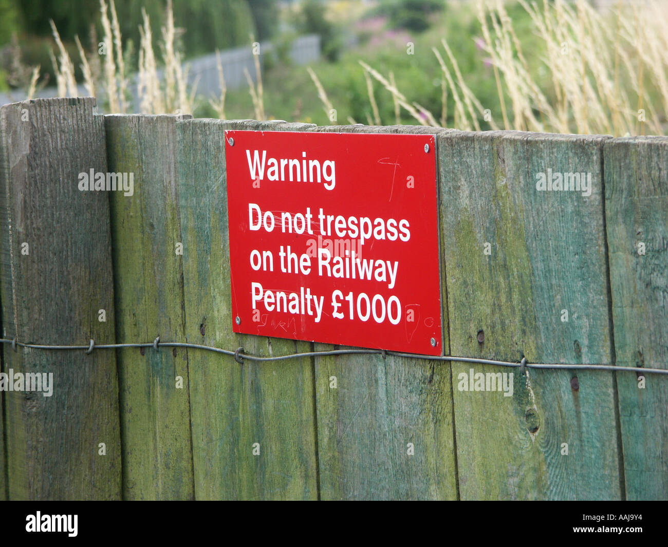 Warning Railway Trespass Sign Stock Photo - Alamy