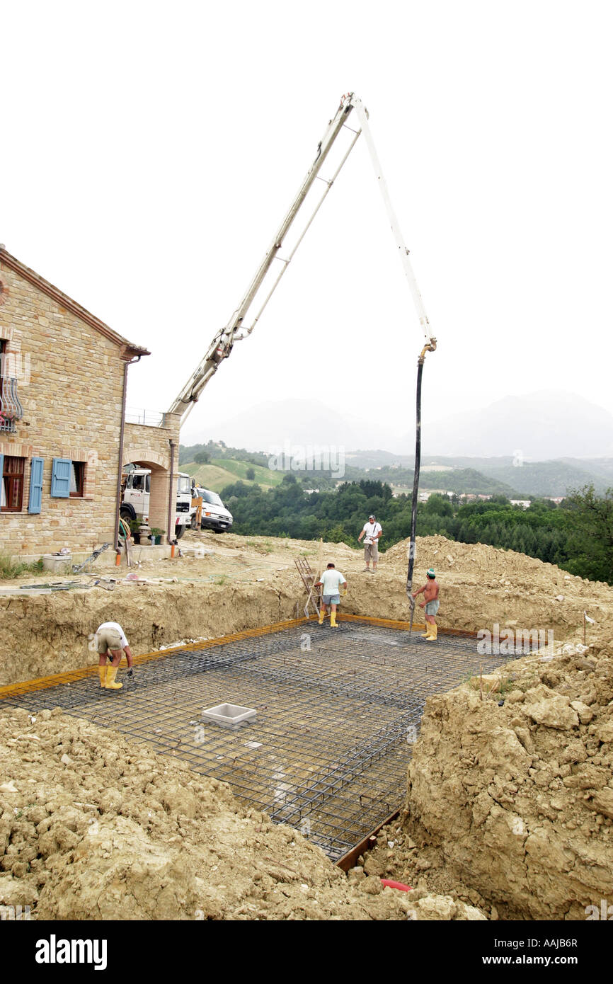 Laying a reinforced concrete foundation for a swimming pool ,Le Marche ...