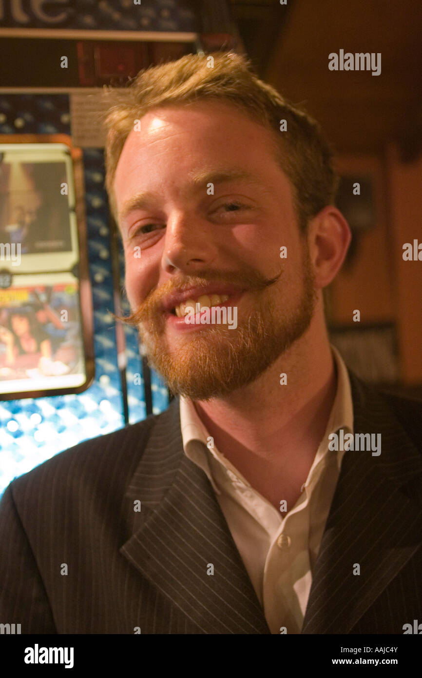 Young Englishman in suit with mustache and beard smiling, Salisbury ...