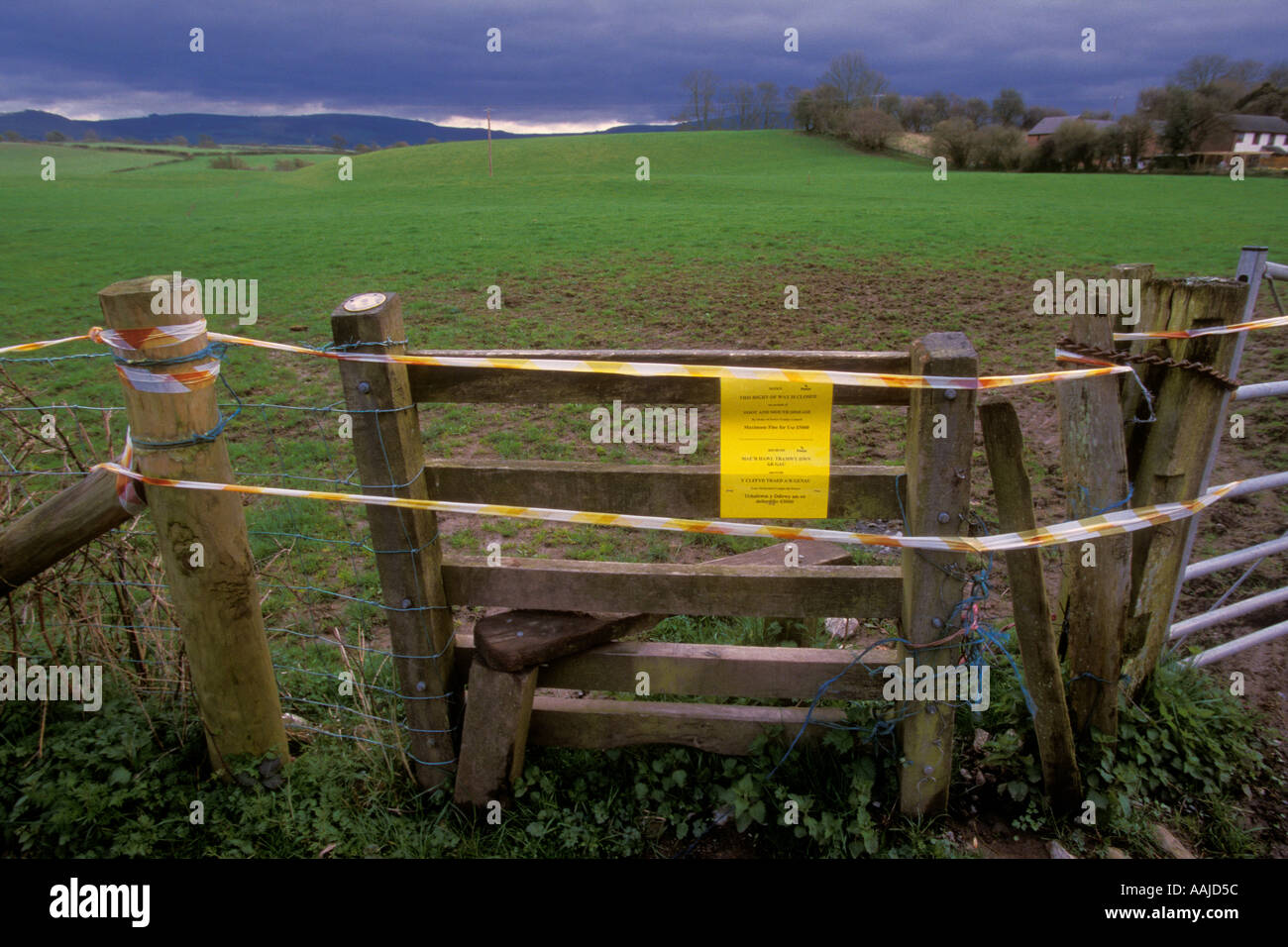 Foot and mouth disease FMD notice on stile closing public footpath ...