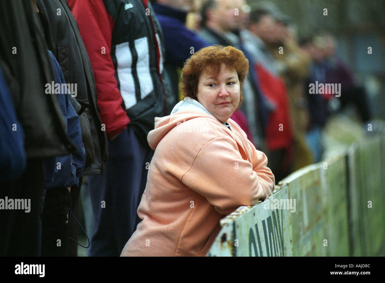 Lone woman amongst a group of men watching a match at Resolven RFC ...