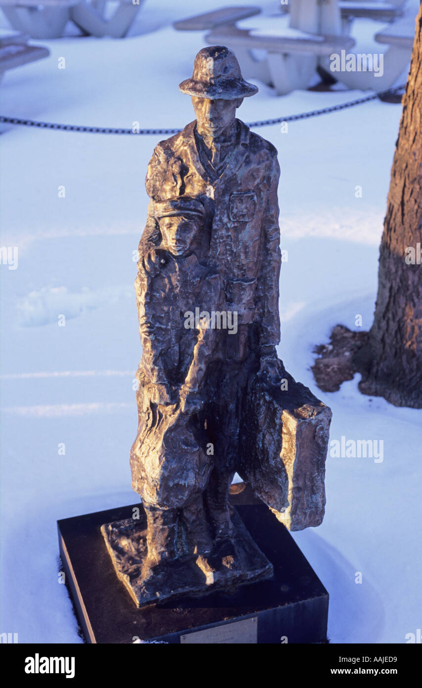 statue of immigrants on ellis island in the snow Stock Photo - Alamy