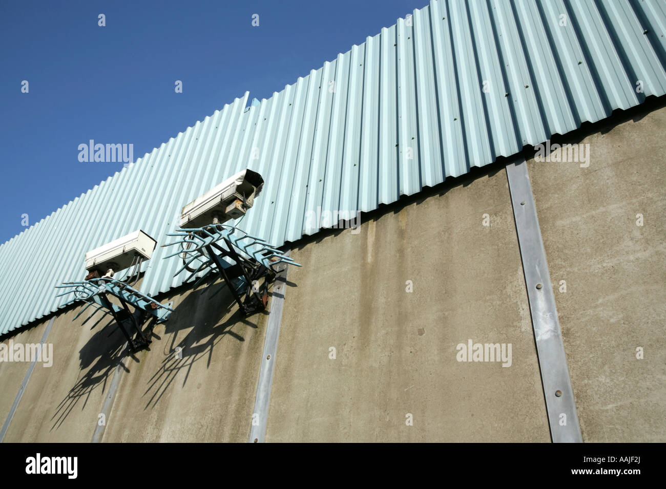 Damaged CCTV cameras on the perimeter wall of the disused Crumlin Road ...