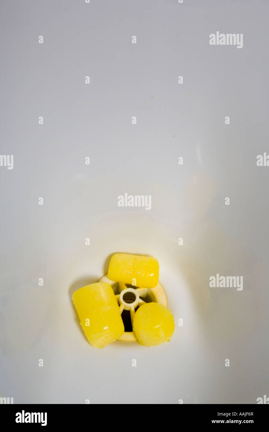 Yellow Urinal cakes Stock Photo - Alamy
