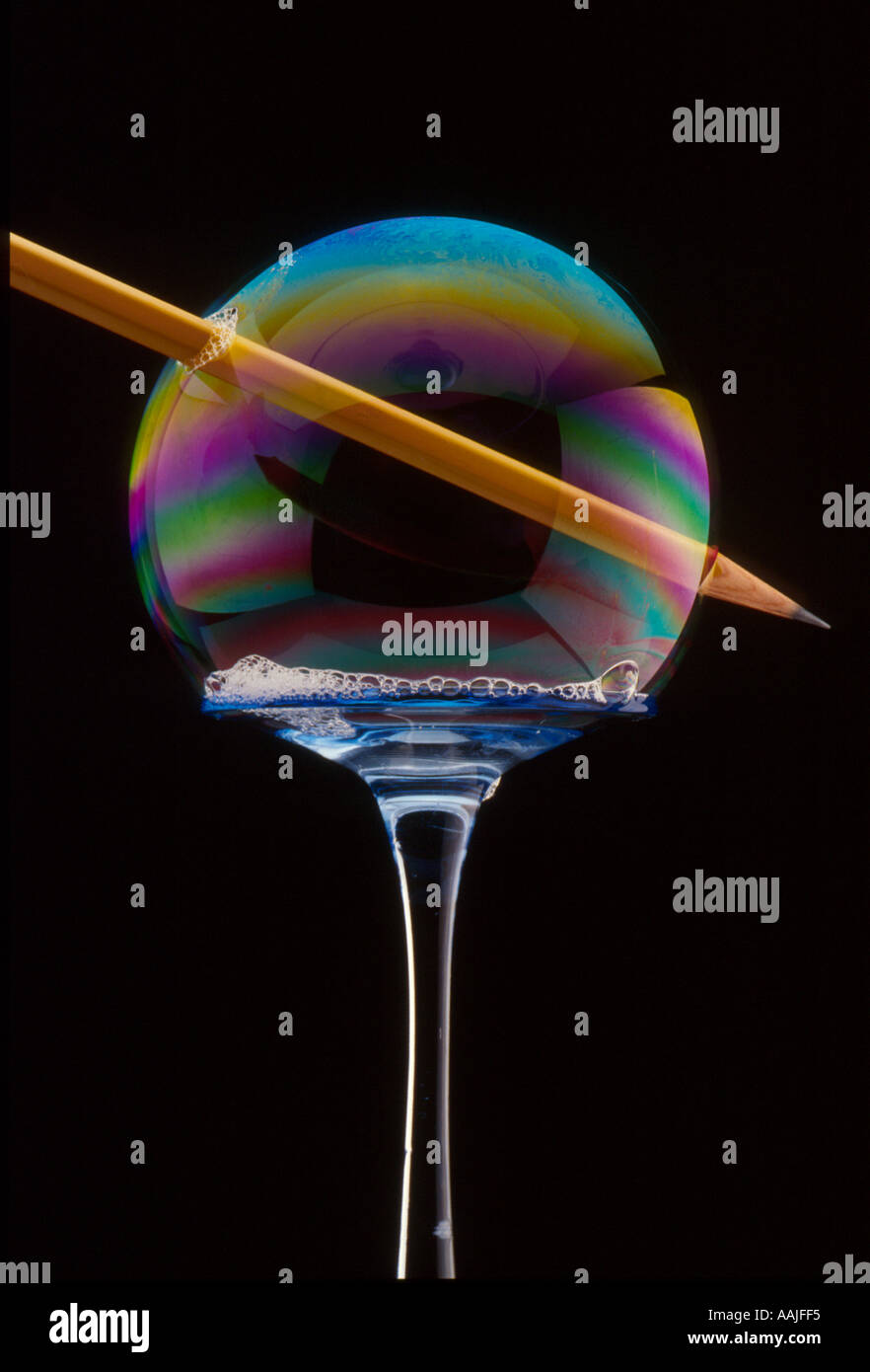 Pencil stuck through soap bubble Stock Photo - Alamy