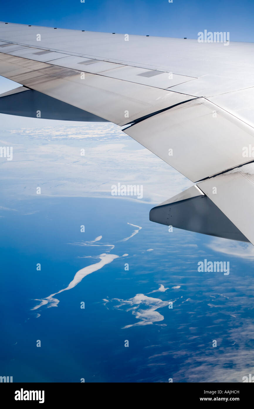 View of northern Canada from airliner showing left port wing Stock ...