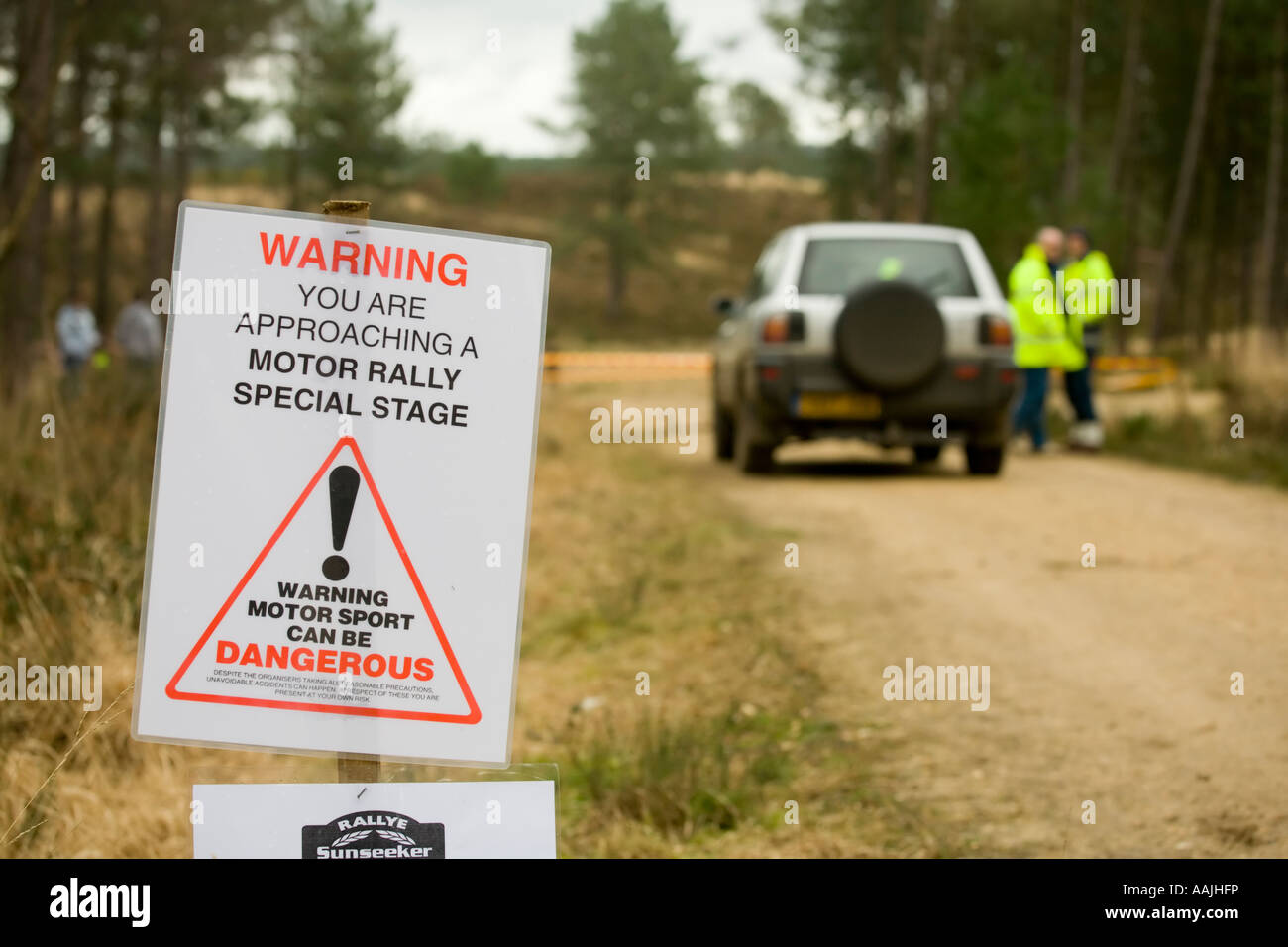 Warning sign at car rally event Stock Photo - Alamy