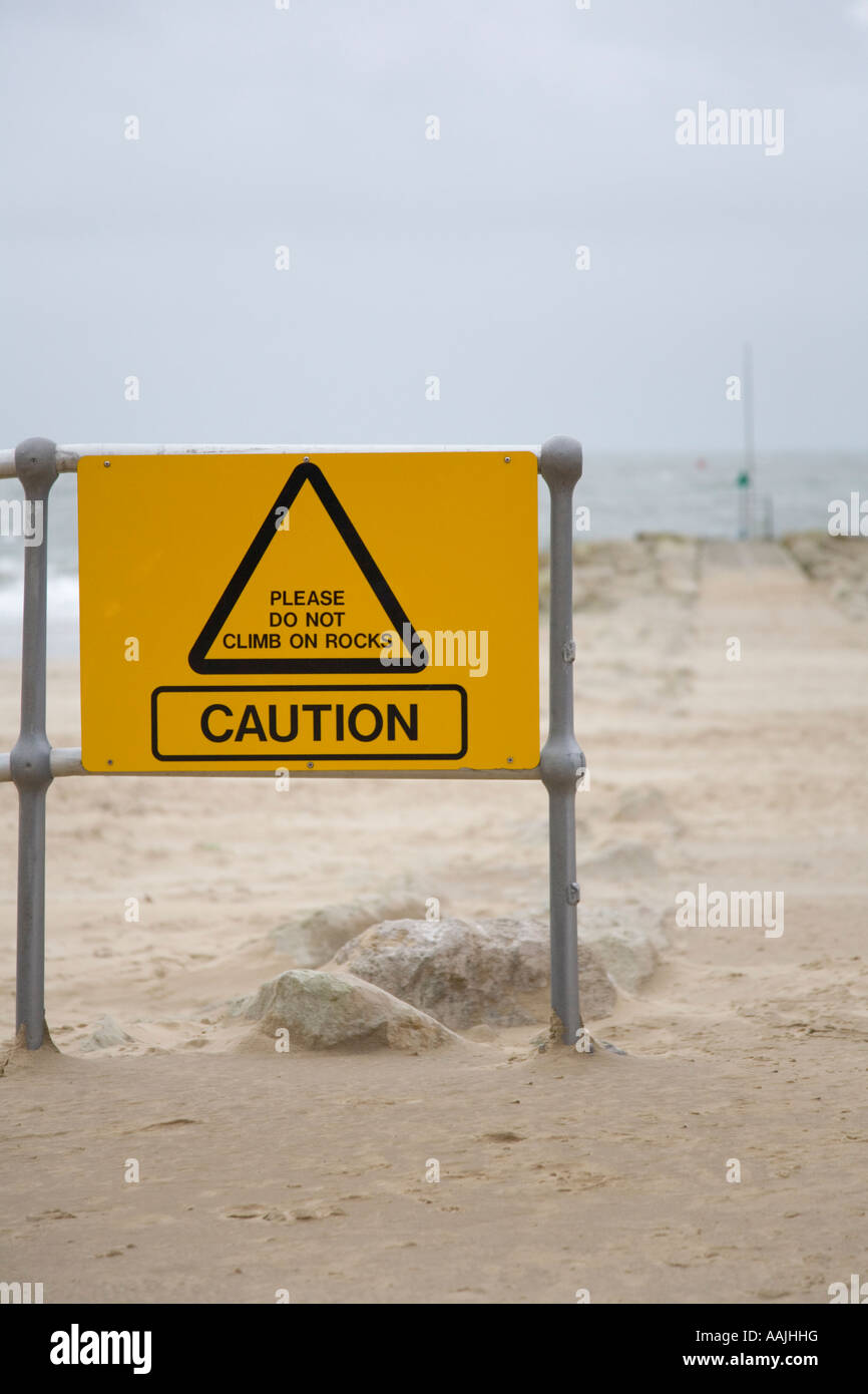 Warning sign at Sandbanks beach Stock Photo - Alamy