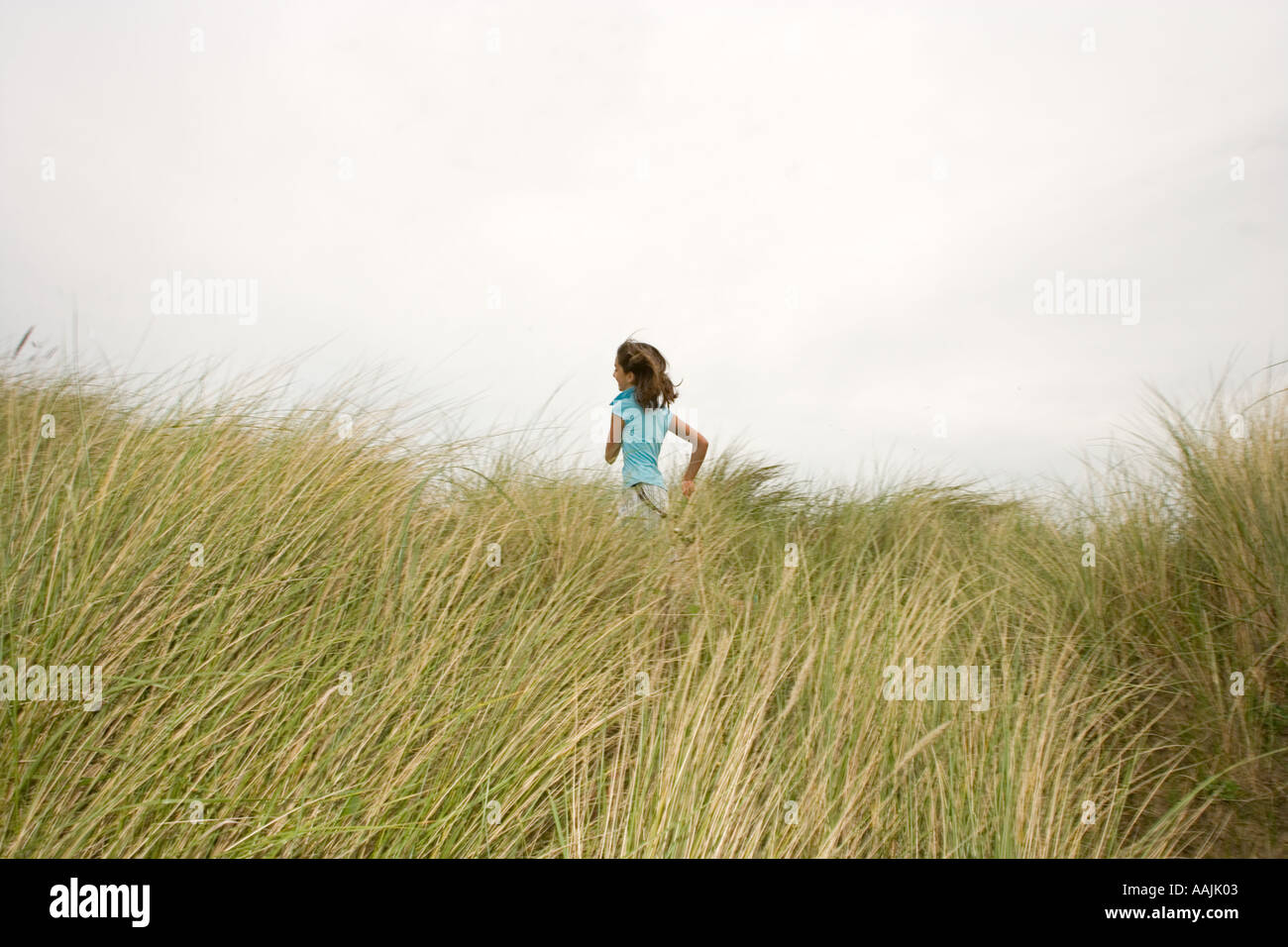 Teenage girl marram grass hi-res stock photography and images - Alamy