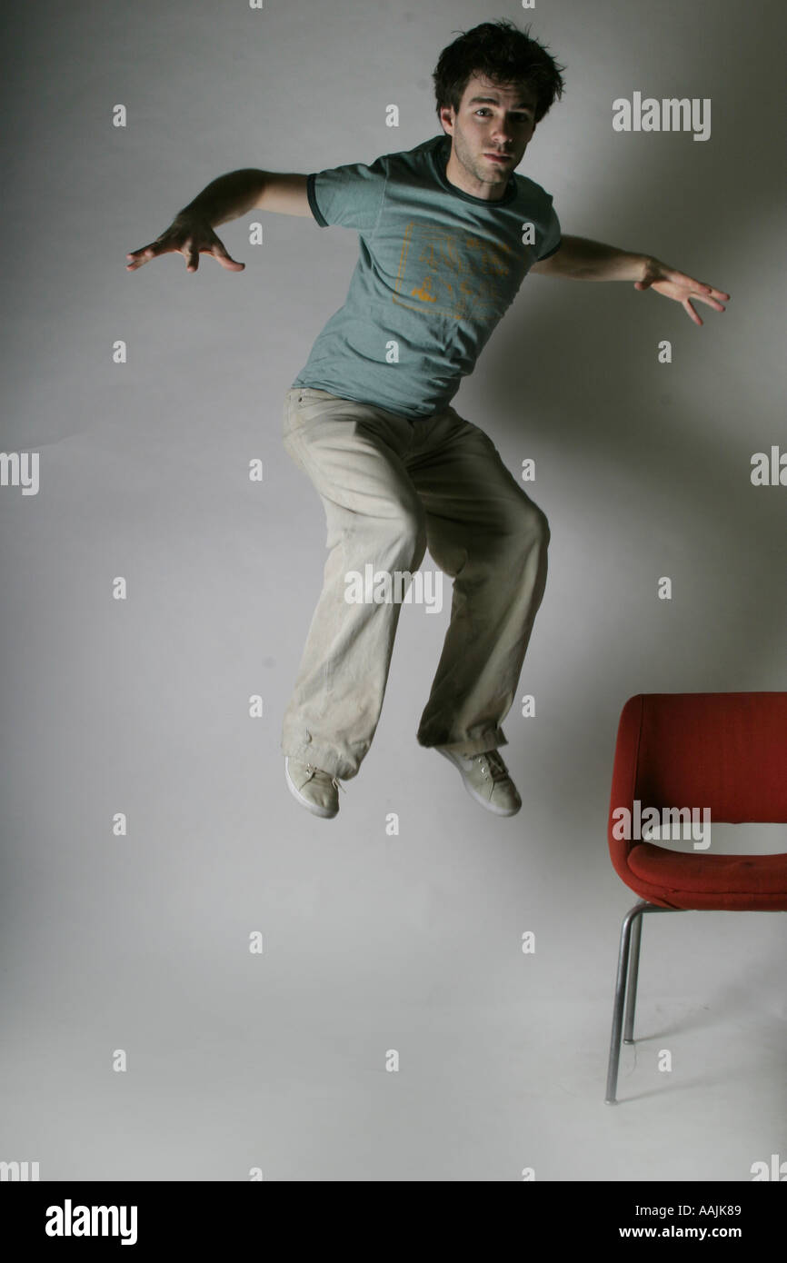 A male is jumping in fright Stock Photo - Alamy