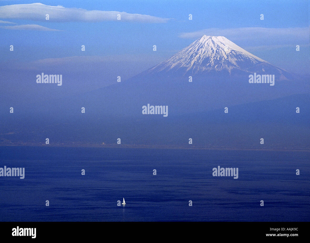 Mt Fuji and a sailboat on Suguru Bay viewed from Izu Shizuoka Japan ...