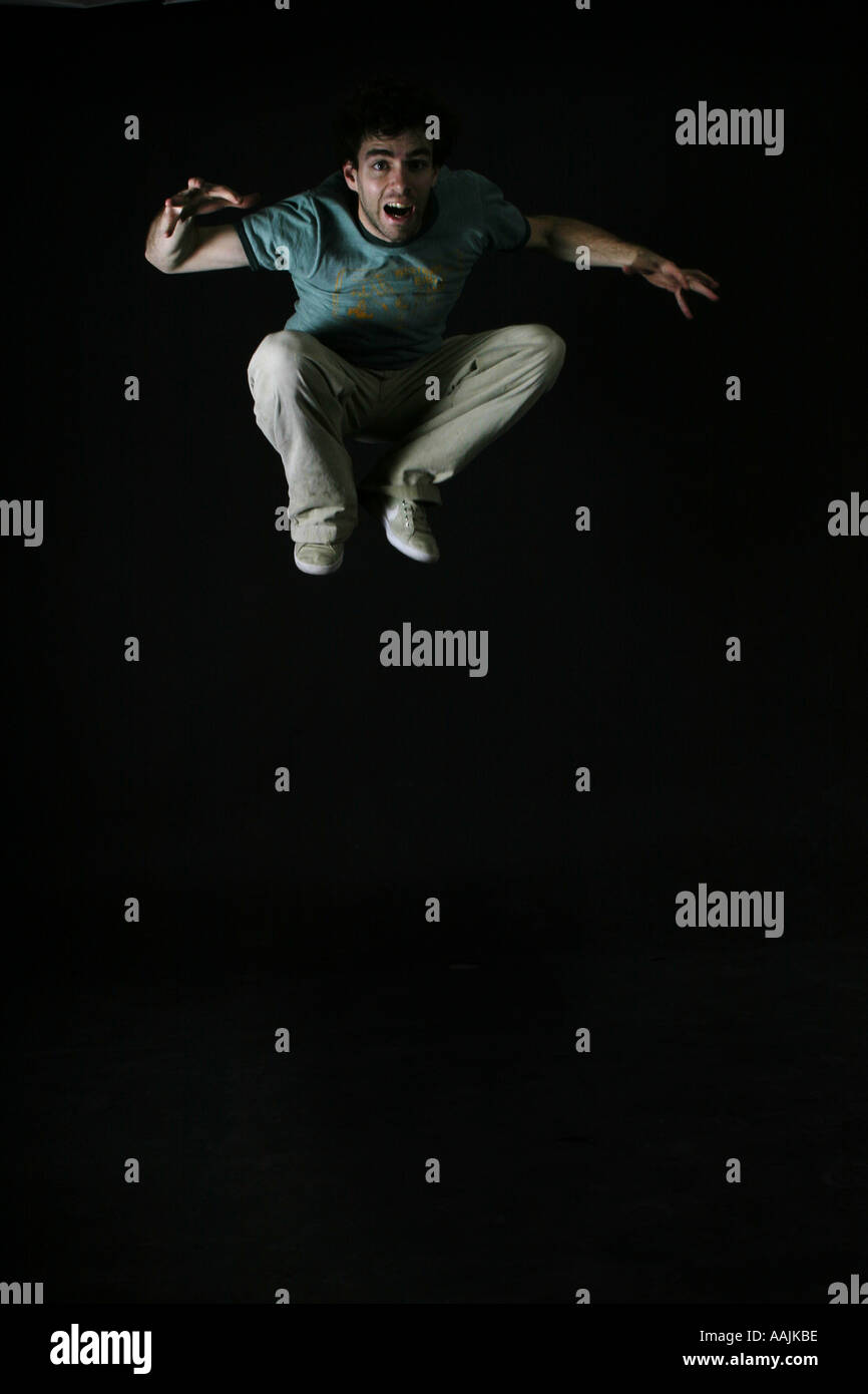 A startled man jumping Stock Photo - Alamy