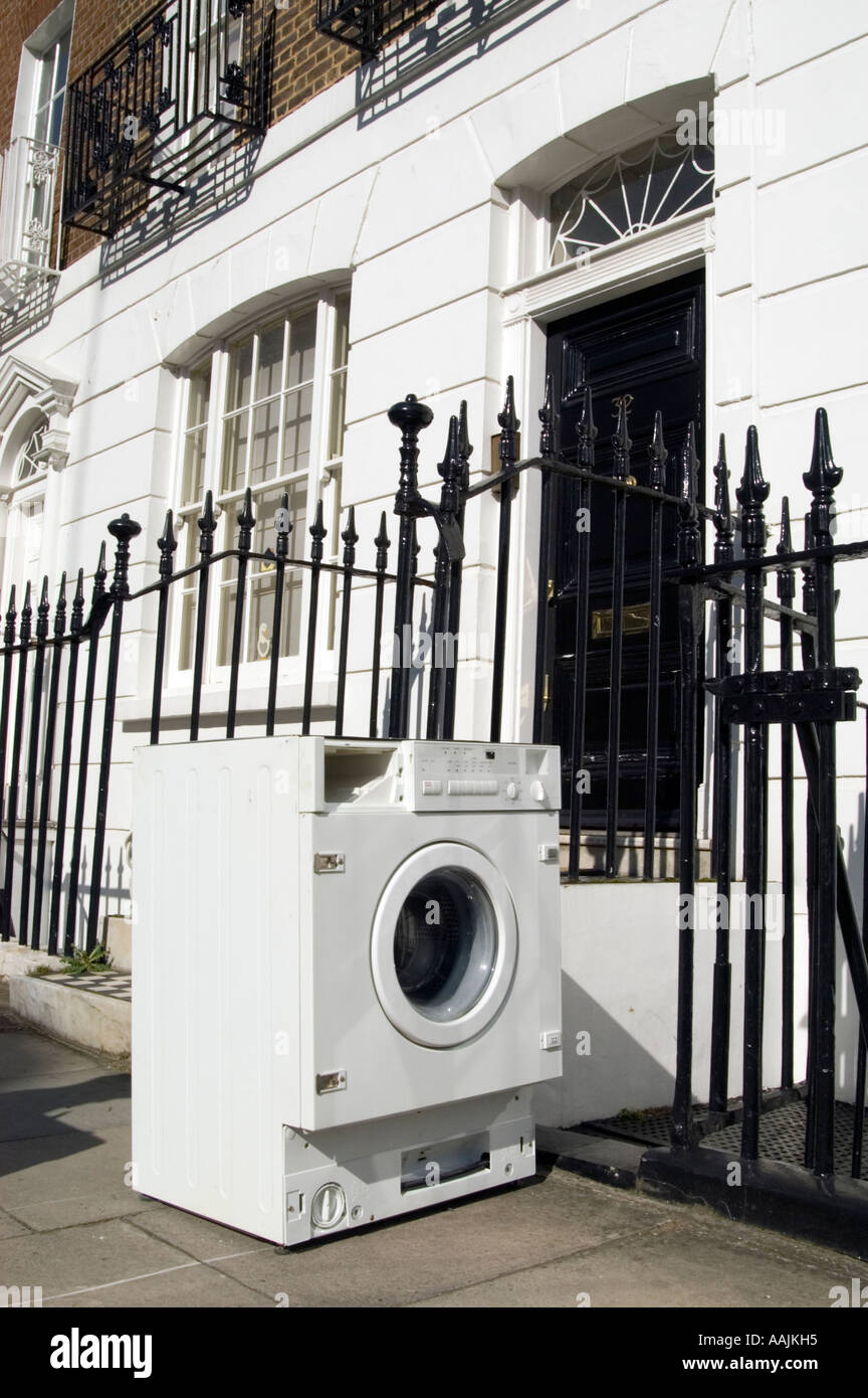 Old washing machine left on pavement, London, England, UK Stock Photo ...