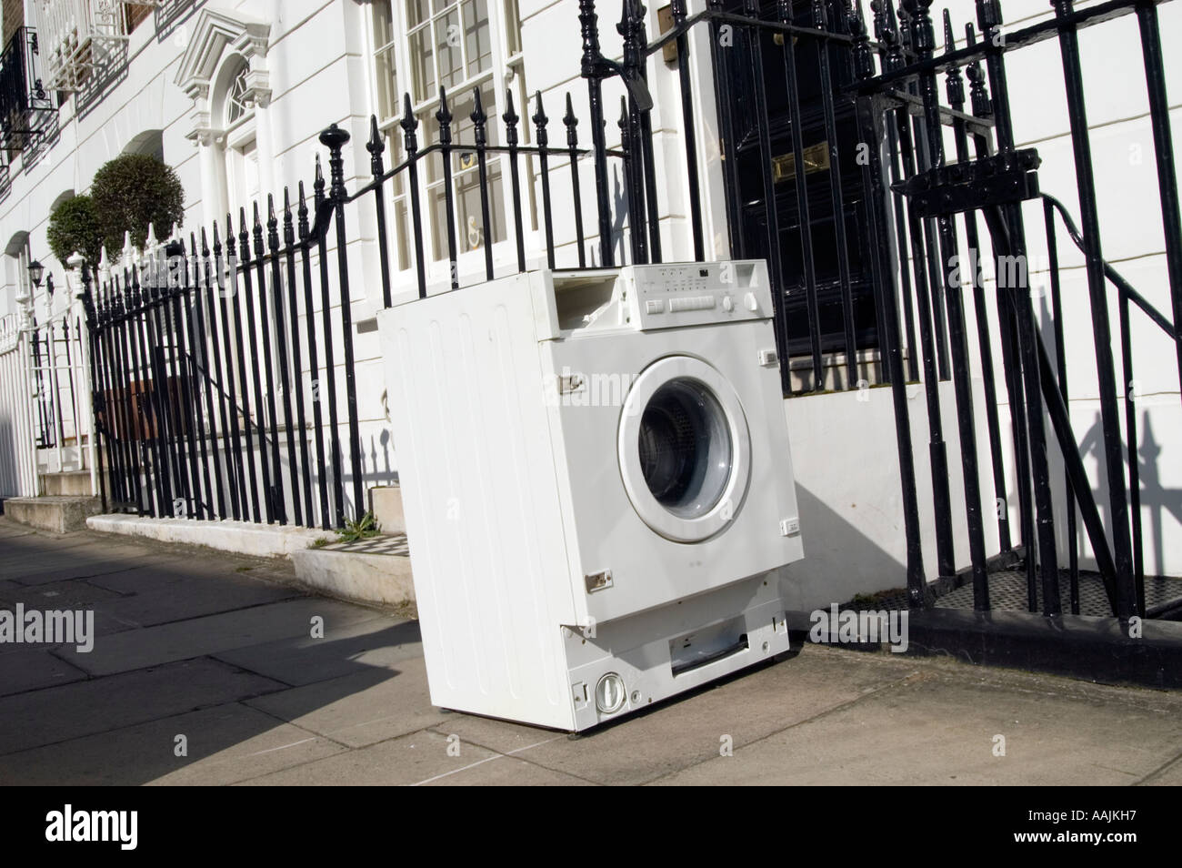 Old washing machine left on pavement, London, England, UK Stock Photo ...