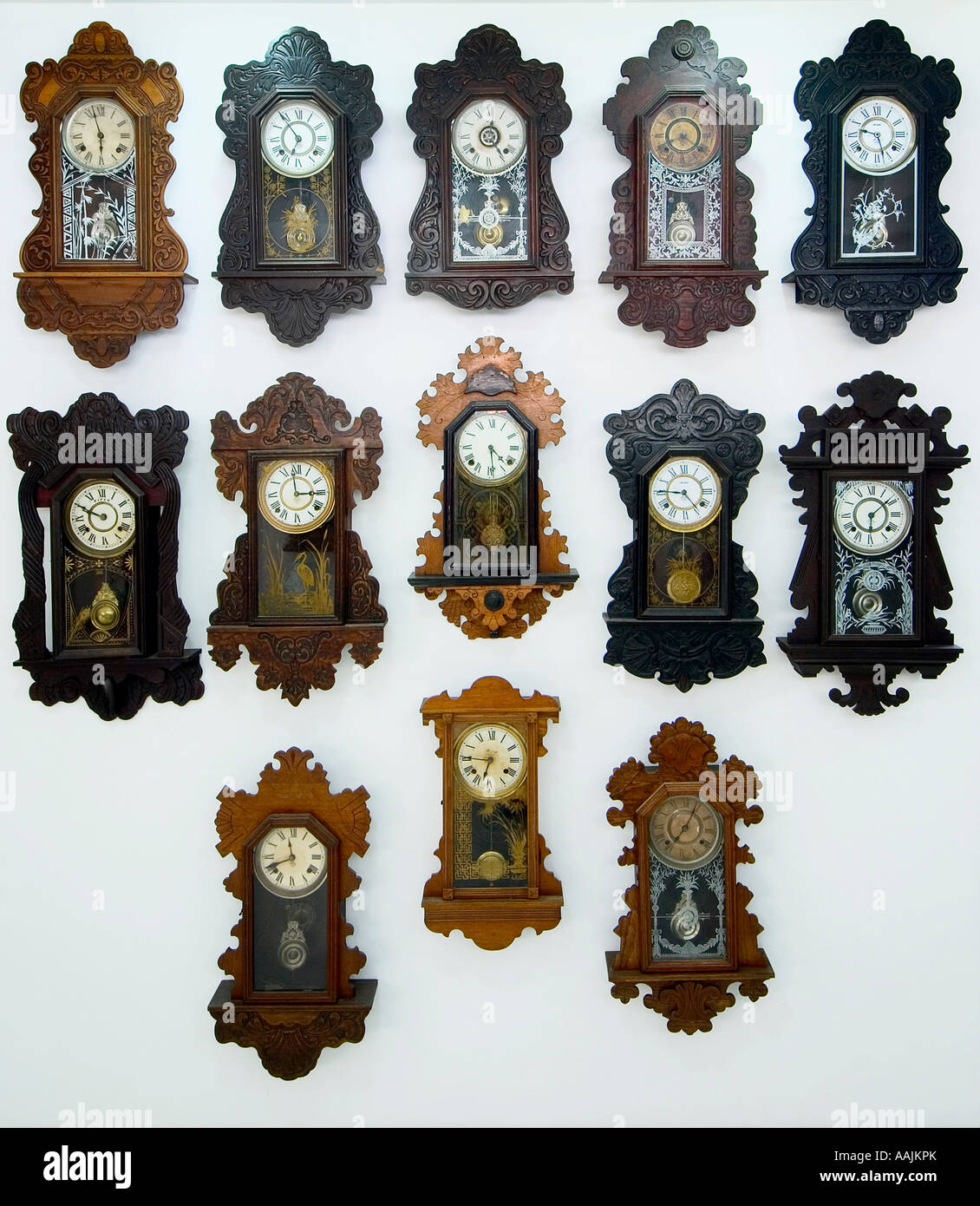 collection of 13 antique clocks, many clocks in a wall Stock Photo - Alamy